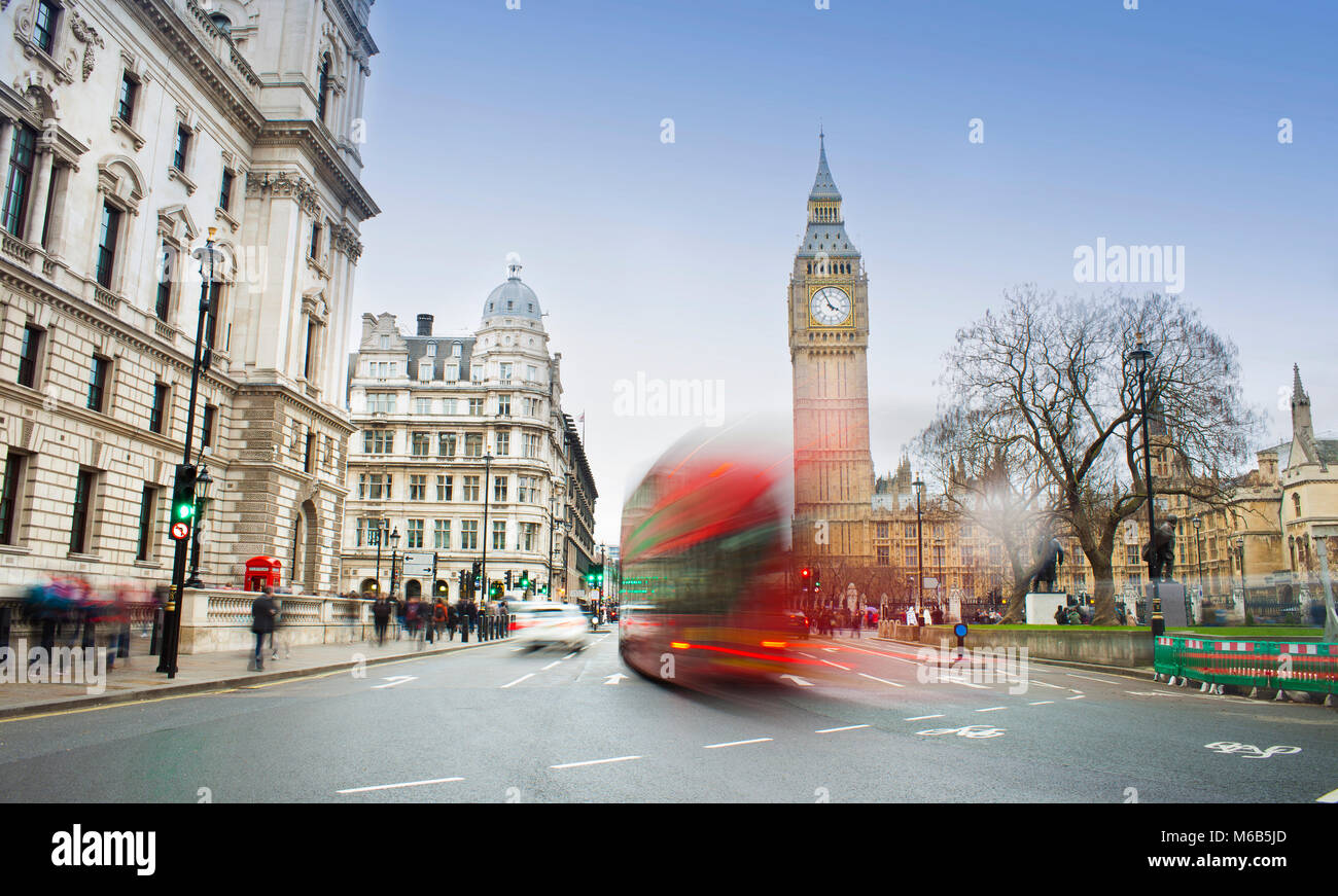 London city scene with red bus and Big Ben in background. Long exposure ...