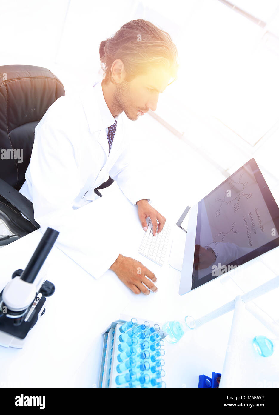 view from above of the scientist-doctor sitting on the computer Stock ...