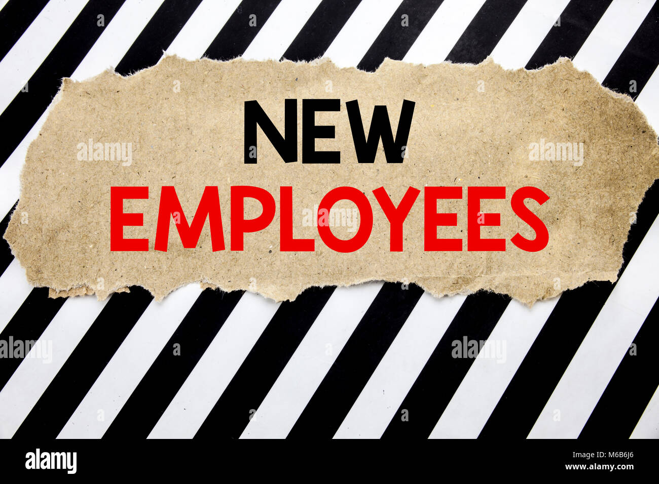 Handwritten text showing New Employees. Business concept writing for ...
