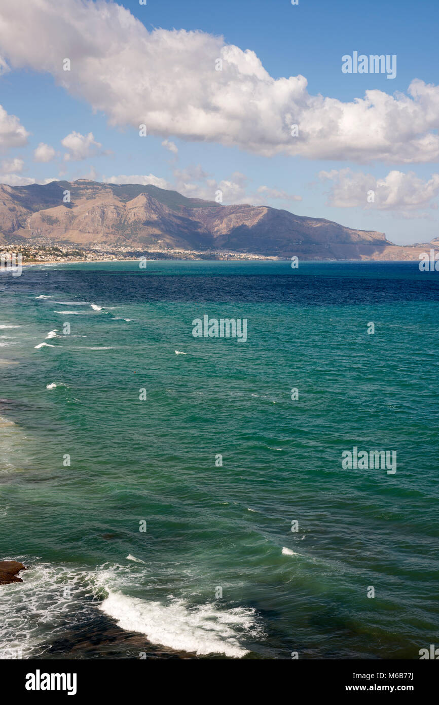 crystal clear sea and frothy waves on the beaches of Palermo in Sicily ...