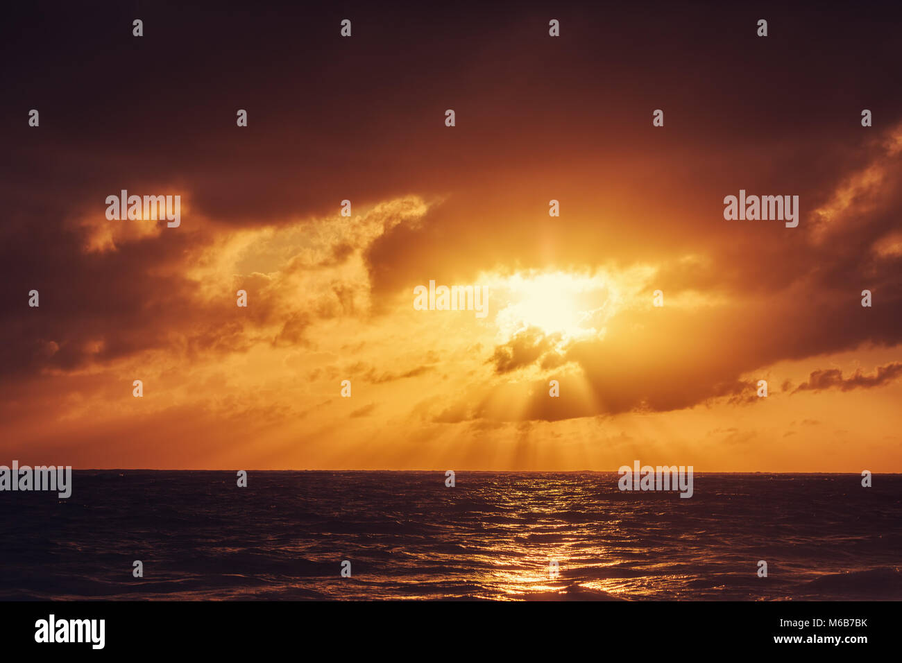 Beautiful cloudscape over the sea, sunrise shot Stock Photo - Alamy