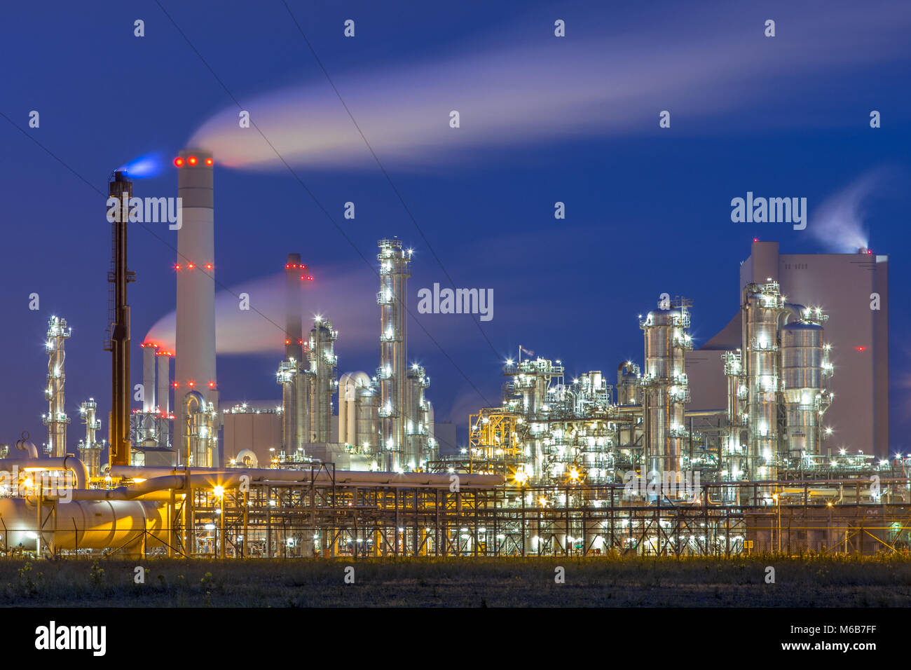 Illuminated chemical plant at Maasvlakte Europoort Rotterdam industrial ...
