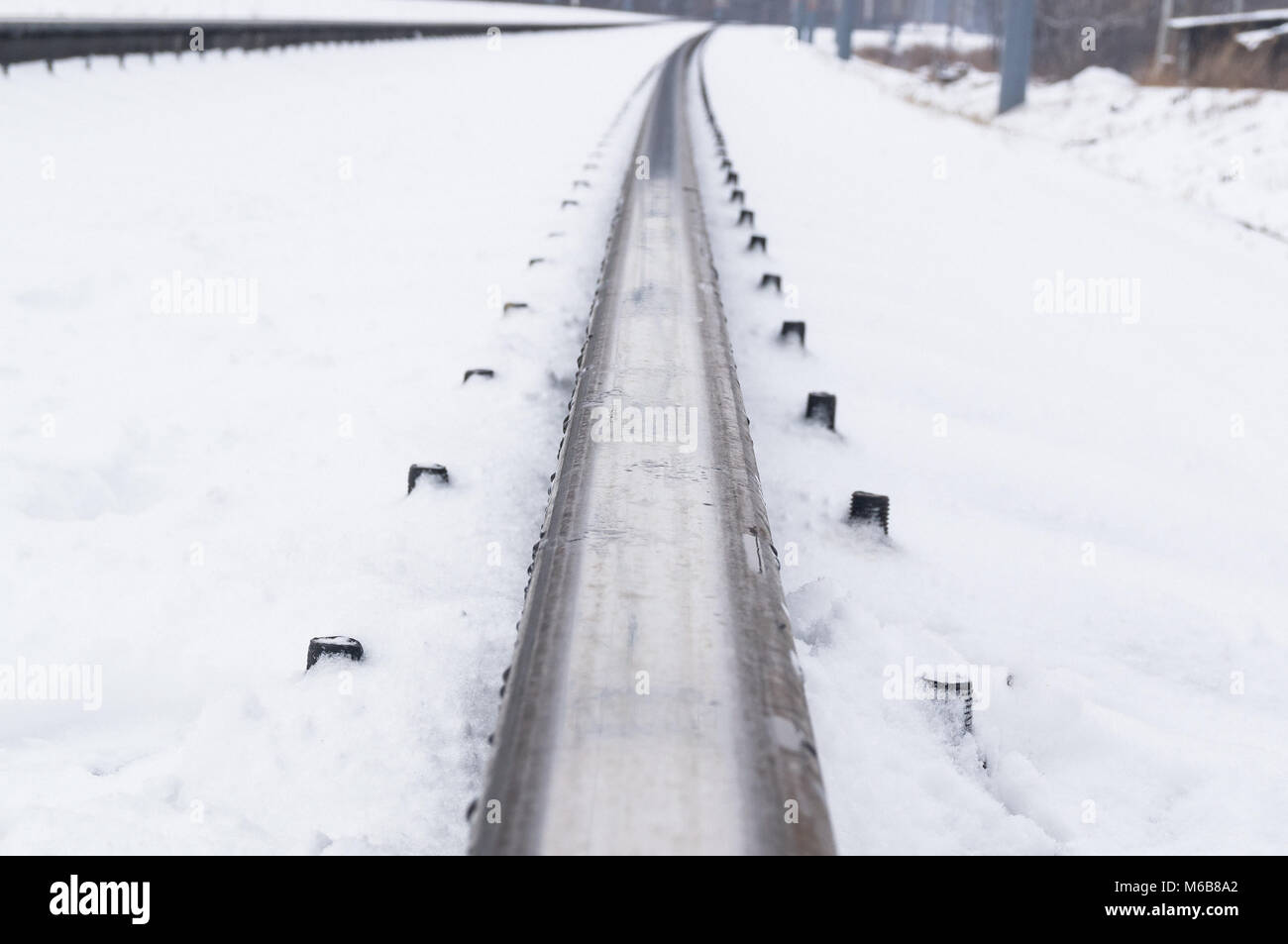 Winter and snowstorm on the railroad tracks. snow-covered rails Stock ...