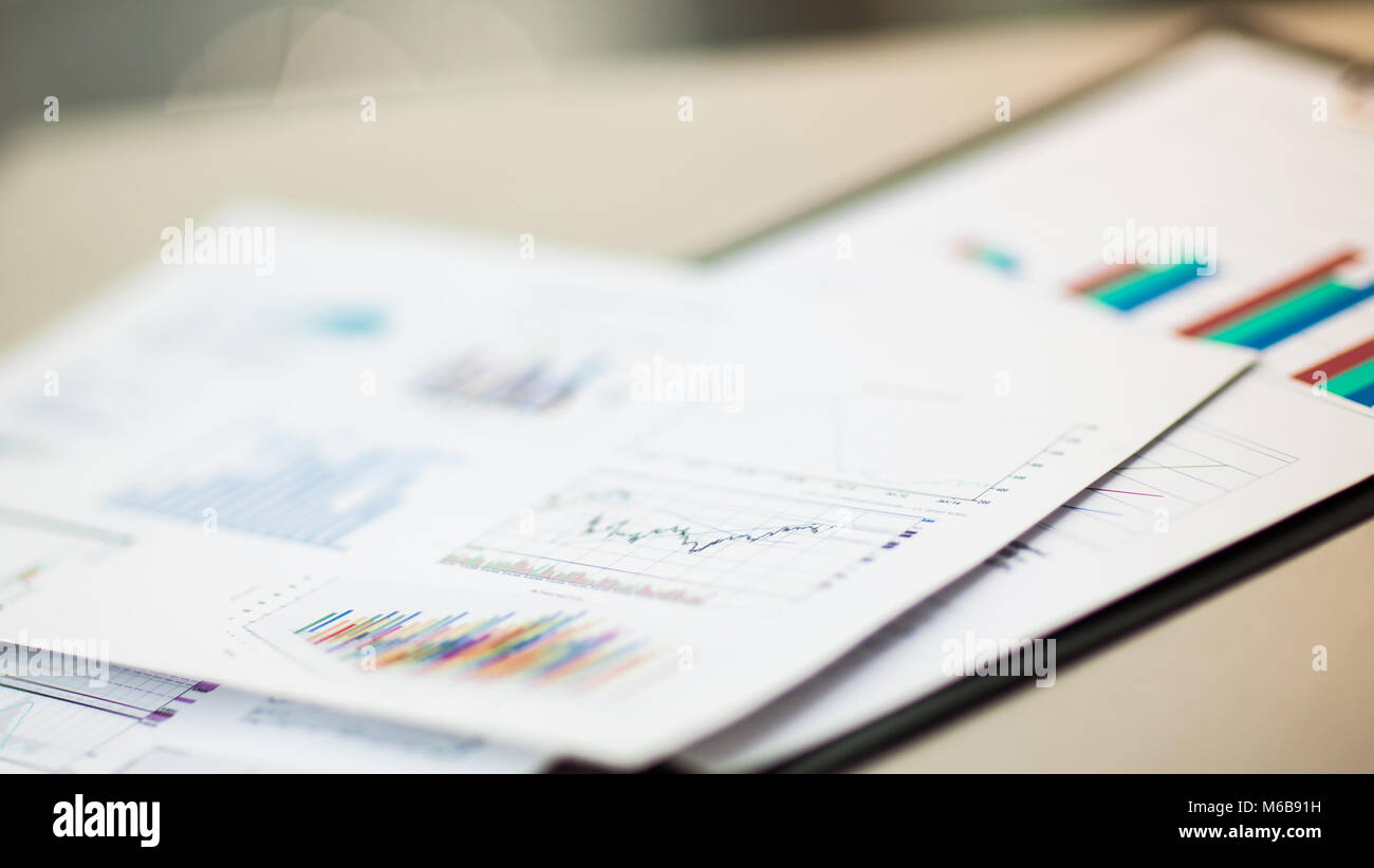 financial charts and graphs on the table Stock Photo - Alamy