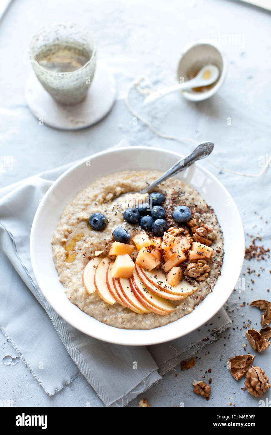 morning oat porridge with fresh fruits and tea Stock Photo - Alamy
