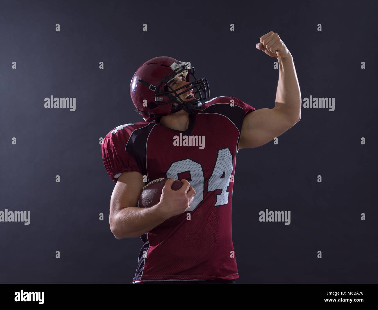 american football player celebrating touchdown isolated on gray ...