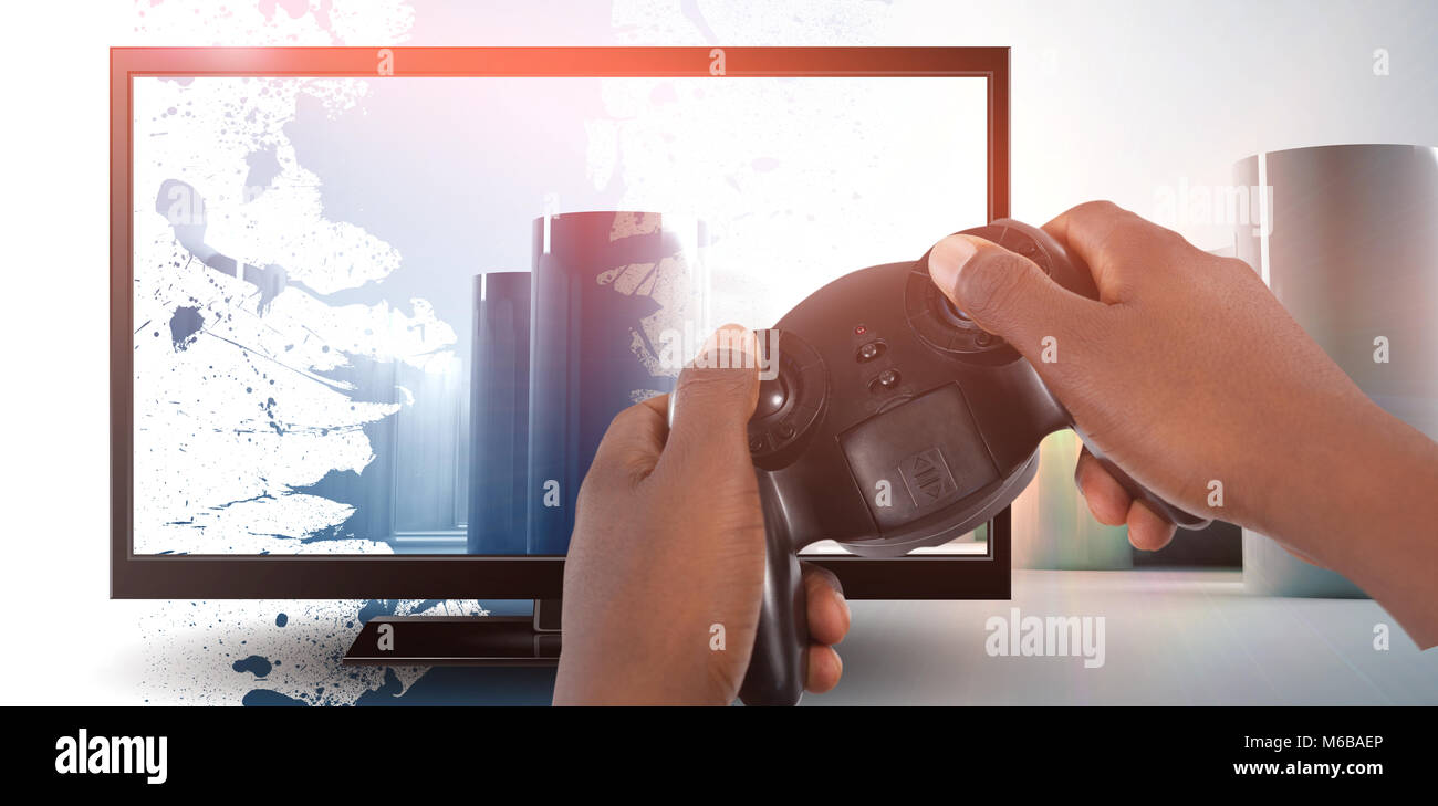 Composite image of hand of man playing video game against white ...