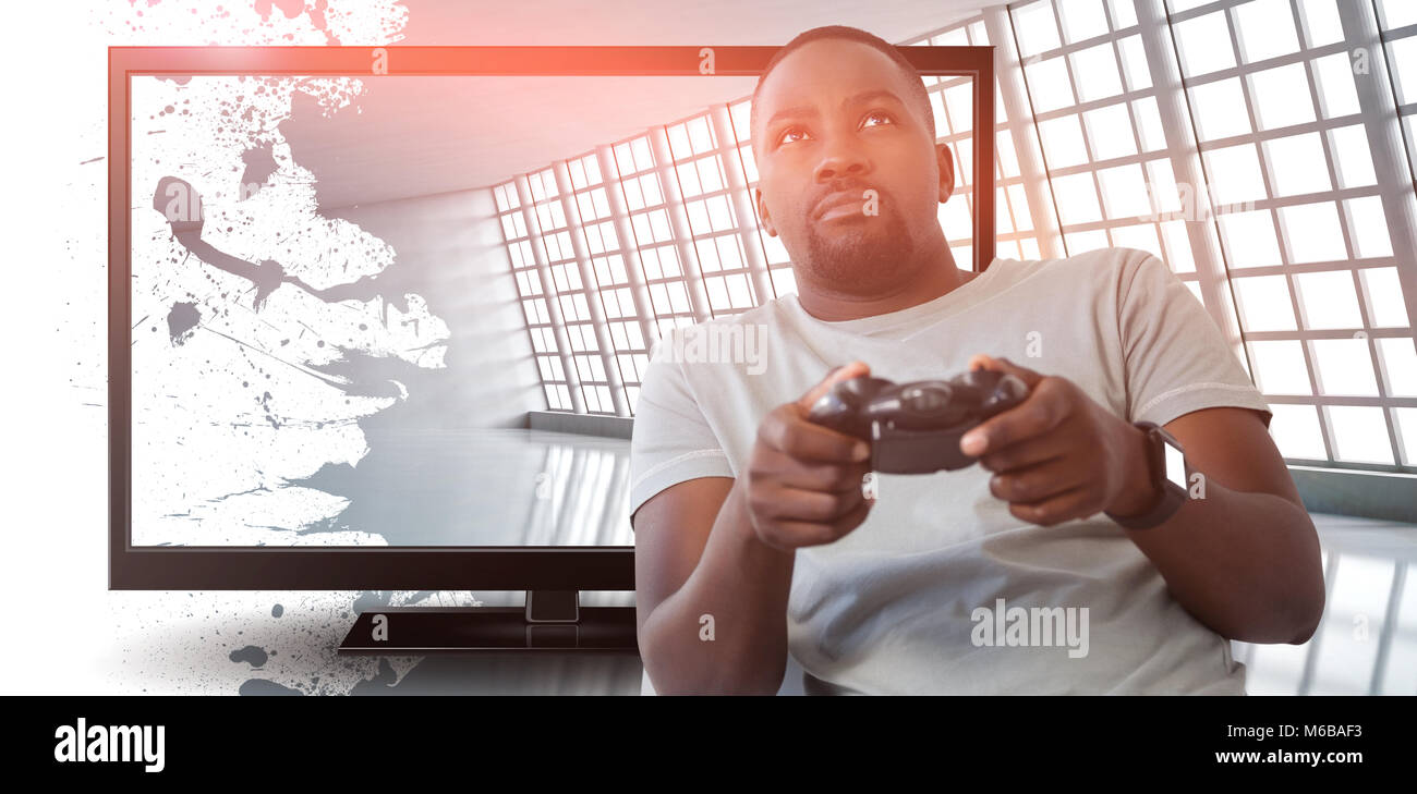 Composite image of man playing video game against white background ...