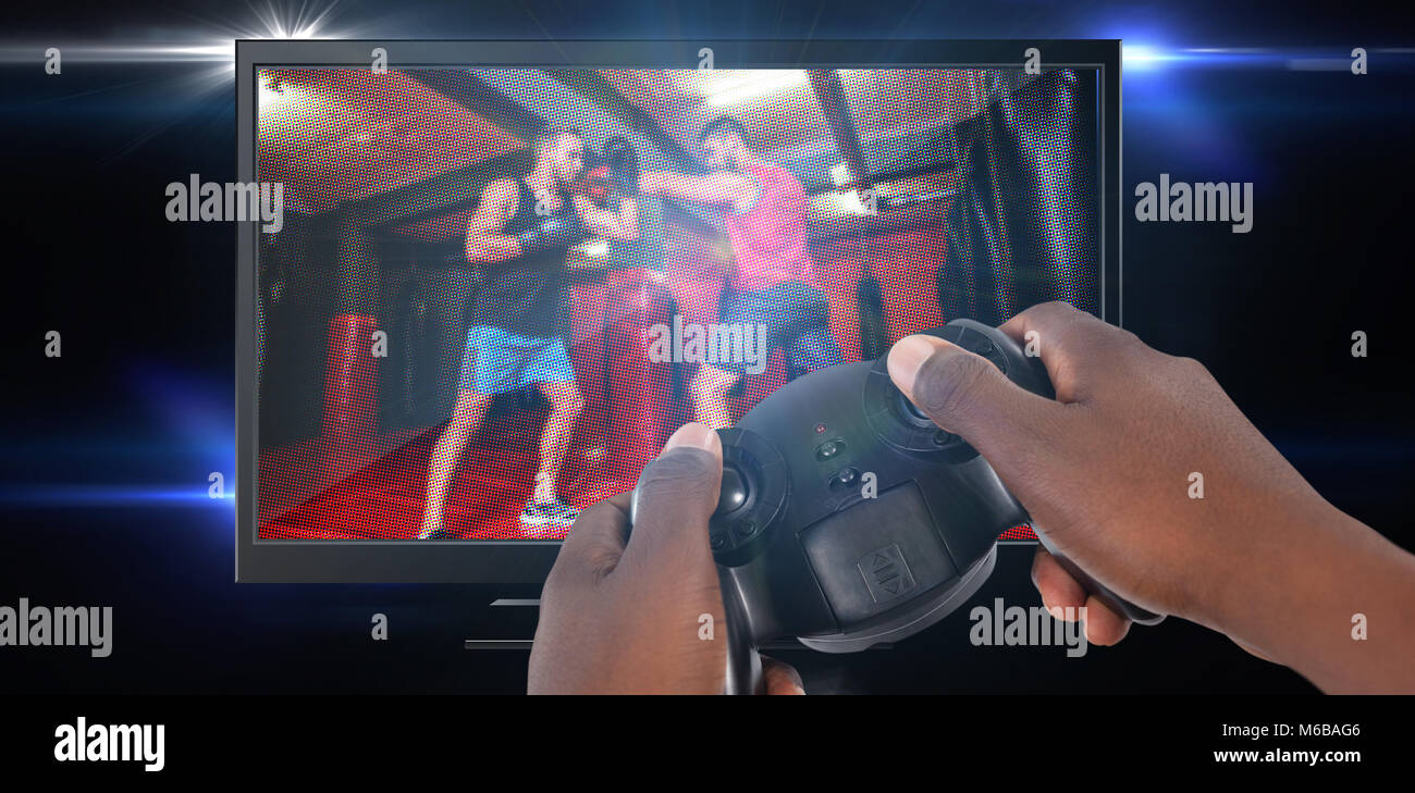 Composite image of hand of man playing video game against white ...