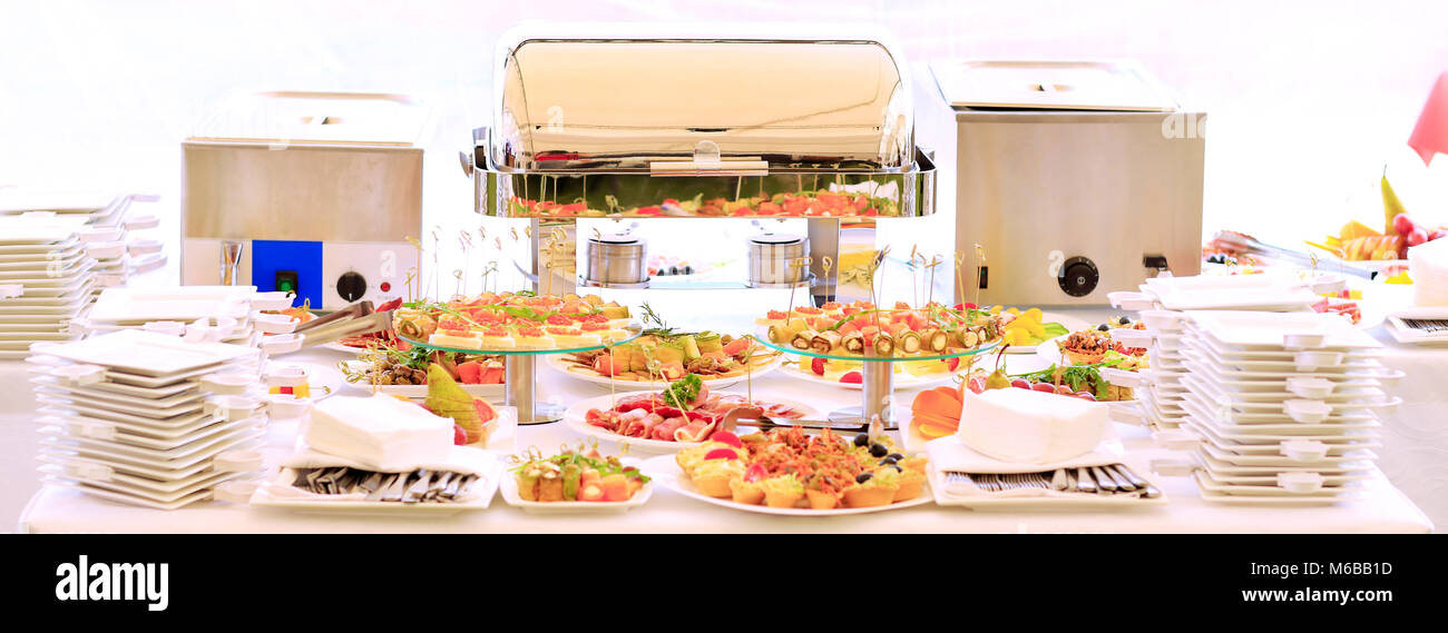 catering table set service with silverware Stock Photo - Alamy