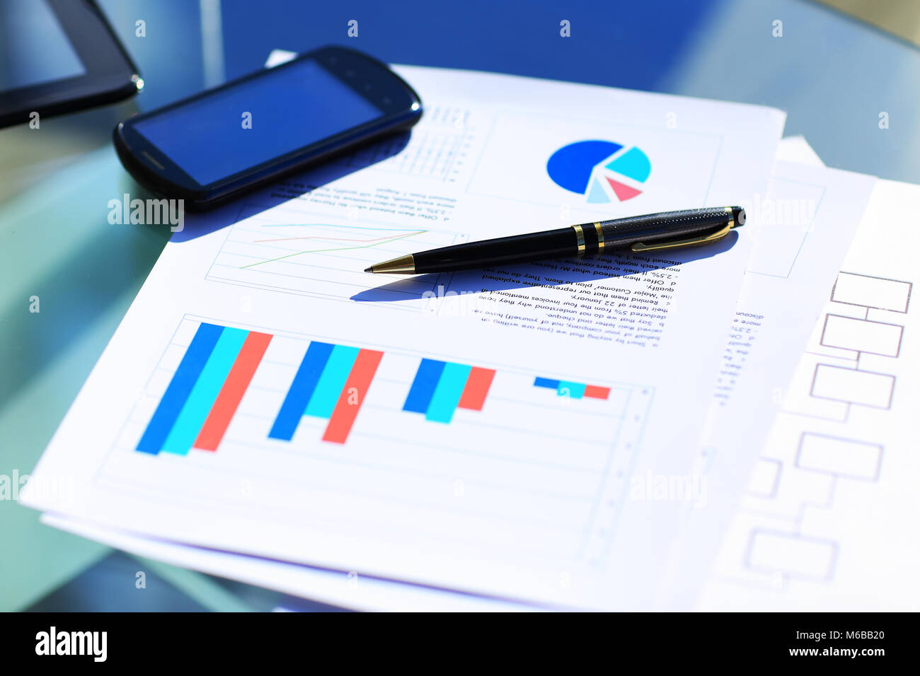 Financial charts on the table Stock Photo - Alamy