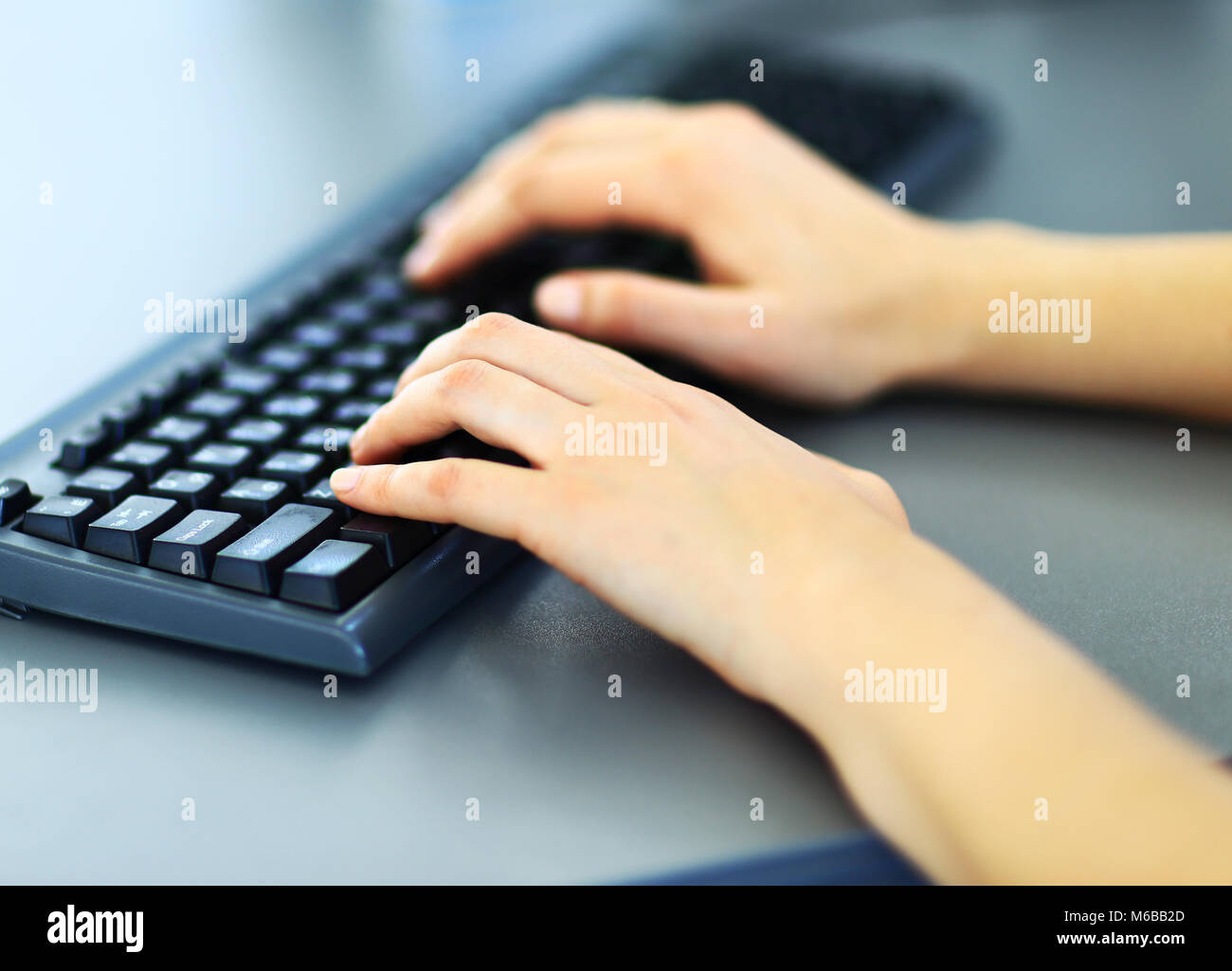 Close-up shot of a female learner typing Stock Photo - Alamy