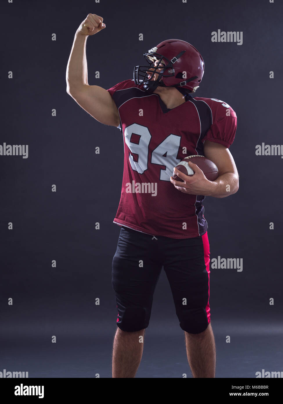 american football player celebrating touchdown isolated on gray ...
