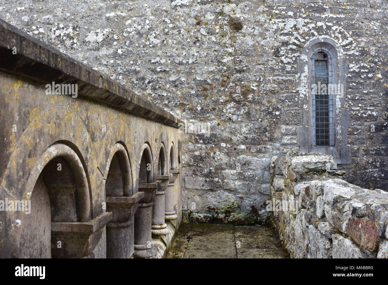 Details of medieval stone wall and arches of church in Clonmacnoise in ...