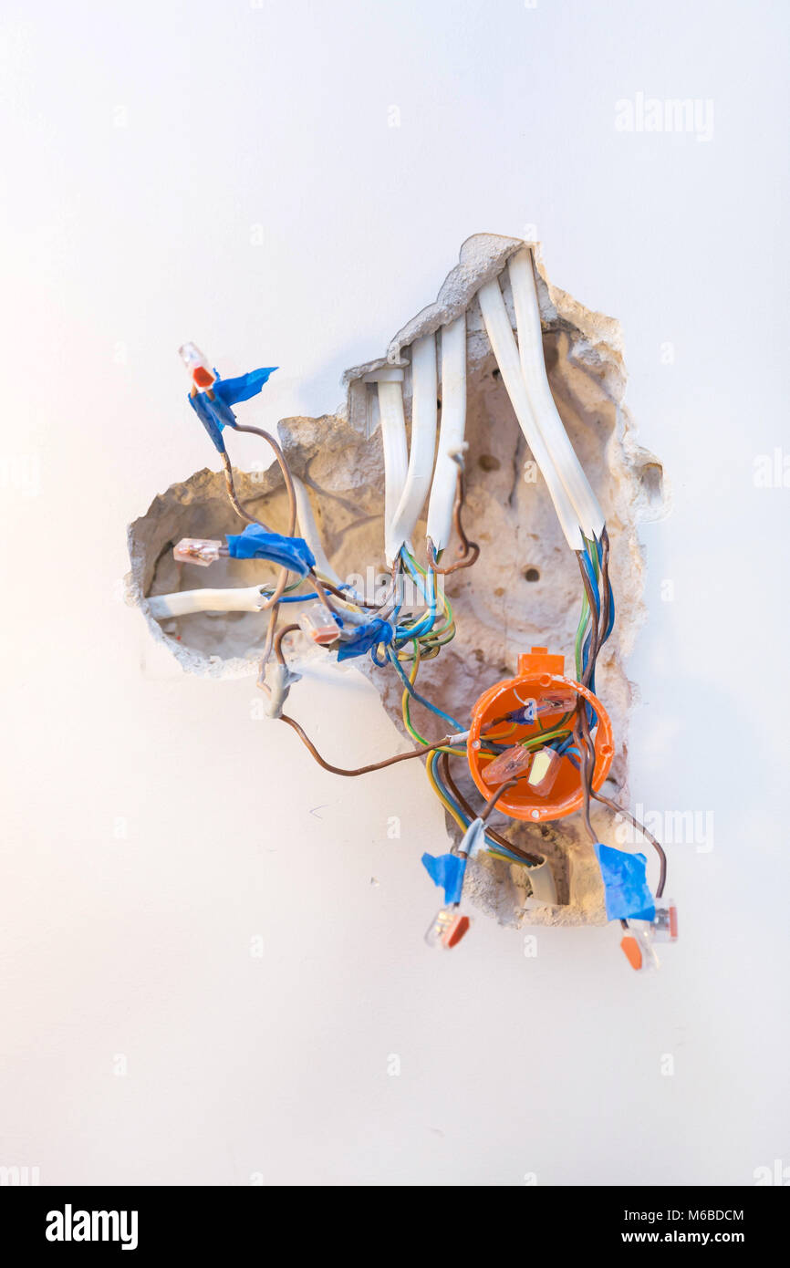 Repairing damaged sockets, installing new Stock Photo - Alamy