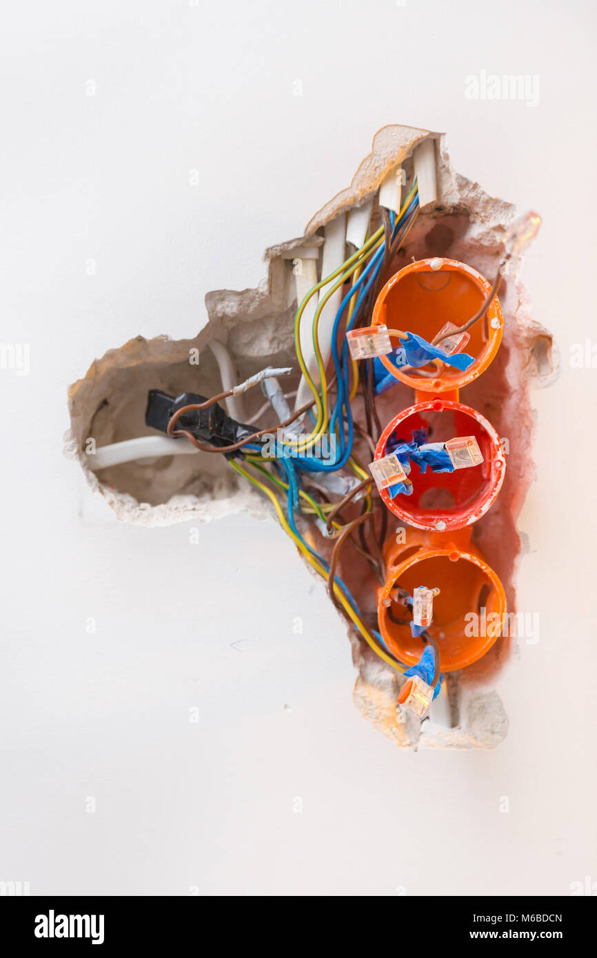Repairing damaged sockets, installing new Stock Photo - Alamy