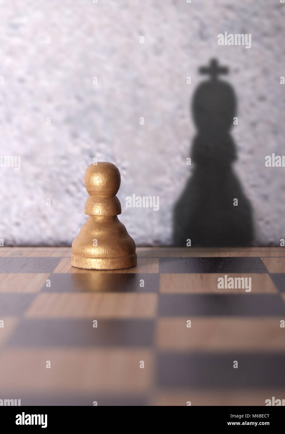 Chess king shadow emerging from a pawn Stock Photo - Alamy
