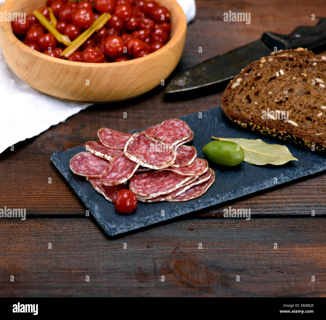 Smoked salami sausage chopped and bread, close up Stock Photo - Alamy