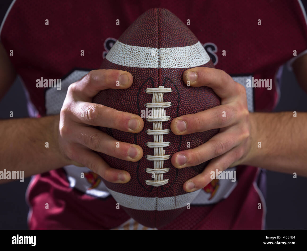 Closeup Portrait of a strong muscular American Football Player isolated ...