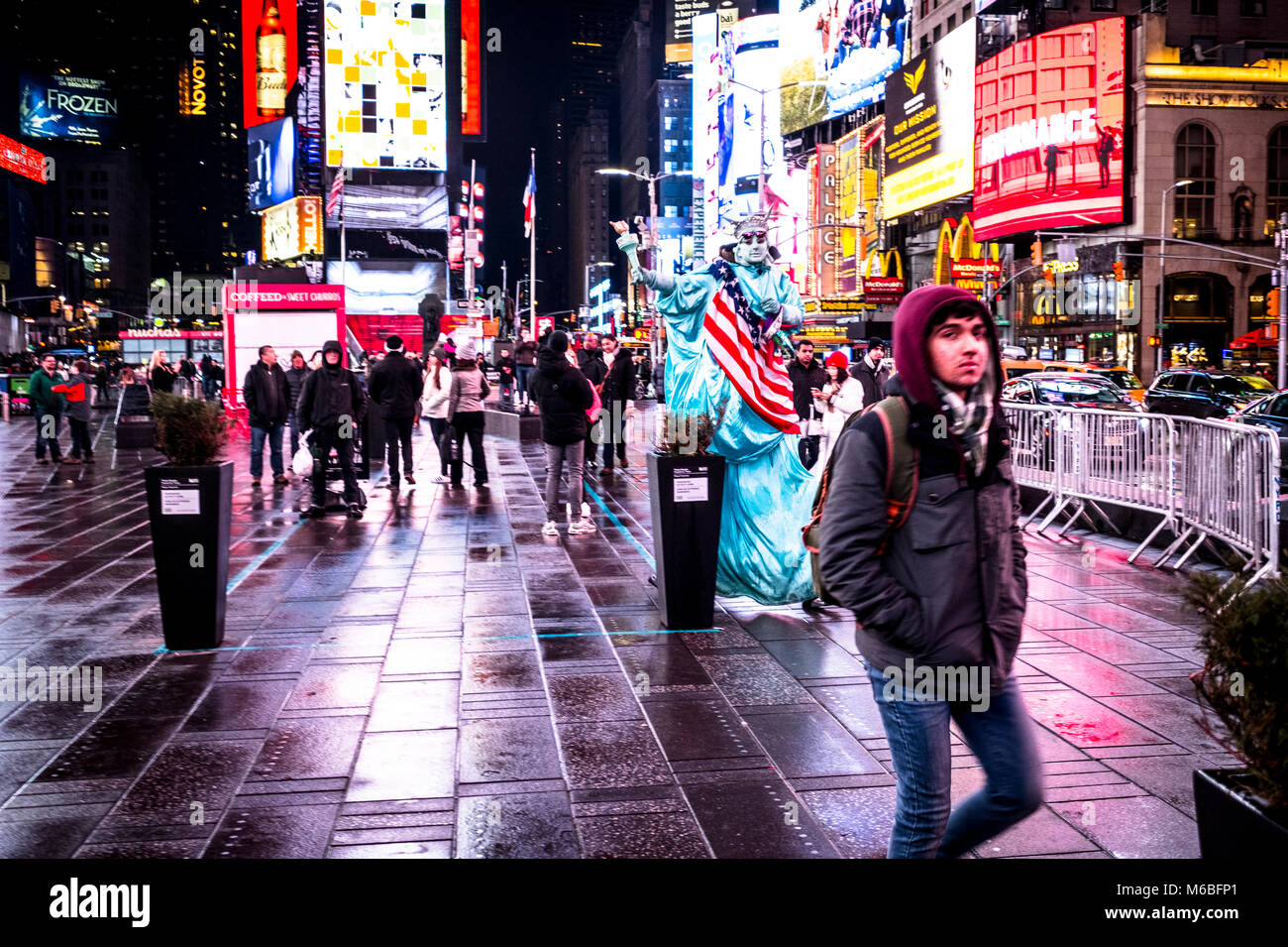 People walking in Times Square at night, midtown Manhattan, New York ...
