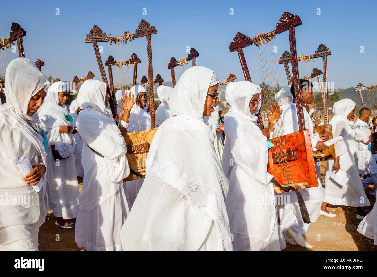 A Procession Of Female Ethiopian Christians Carrying Begenas Arrive At ...