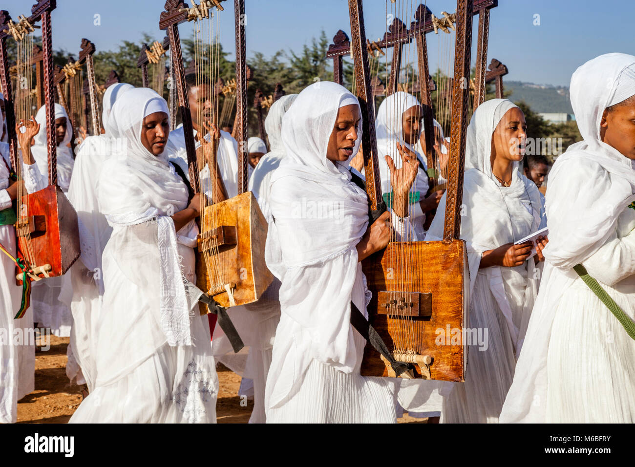 A Procession Of Female Ethiopian Christians Carrying Begenas Arrive At ...