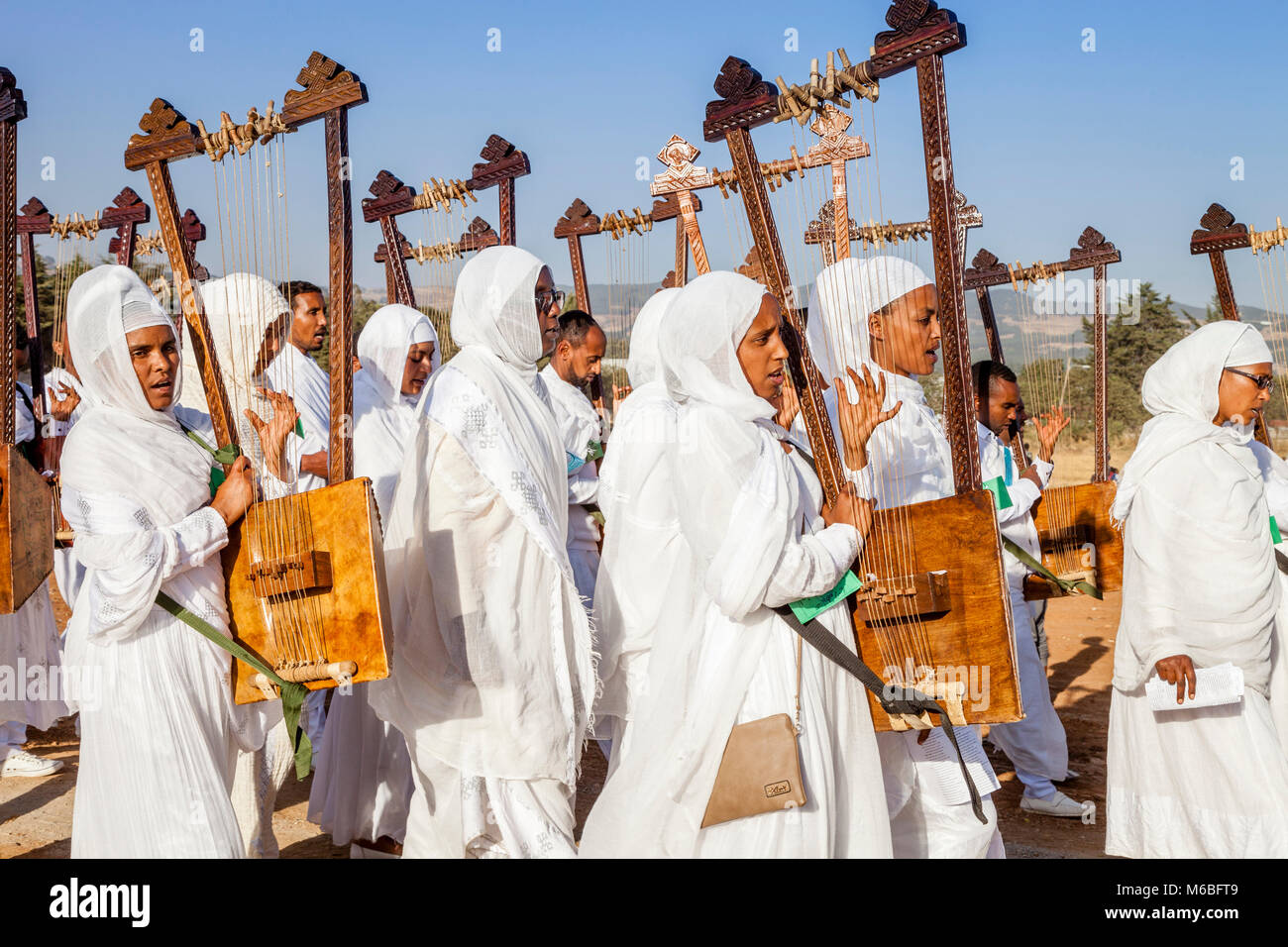 A Procession Of Female Ethiopian Christians Carrying Begenas Arrive At ...