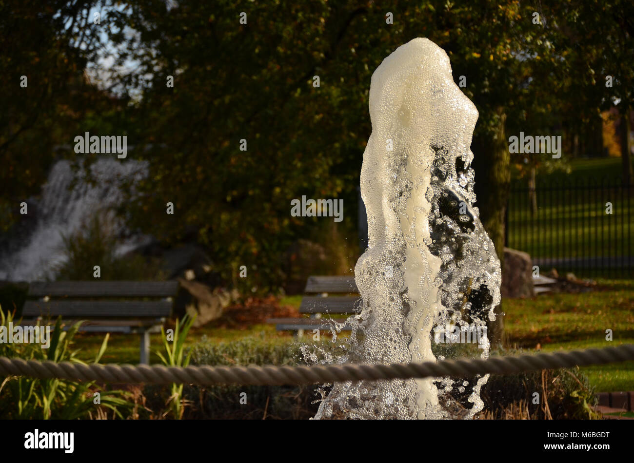 water captured at high speed from fountain in park Stock Photo - Alamy