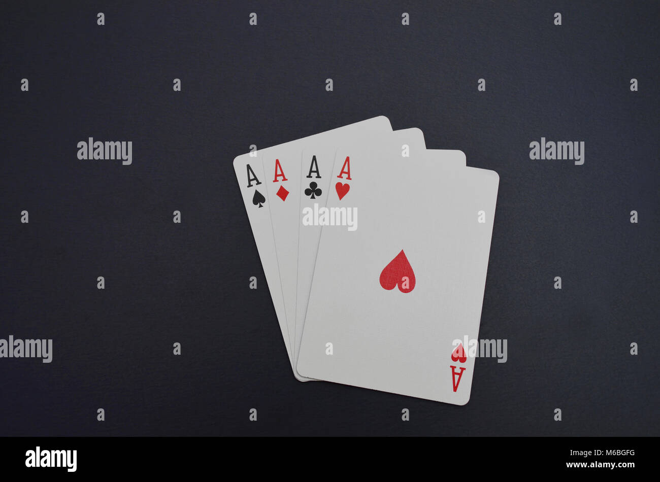 four aces poker hand Stock Photo - Alamy
