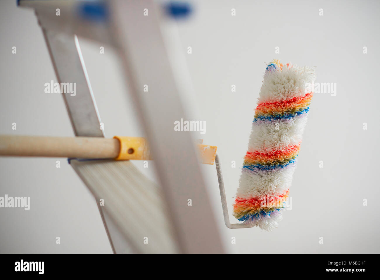 Tools for painting walls. Platen tool on step ledder Stock Photo - Alamy