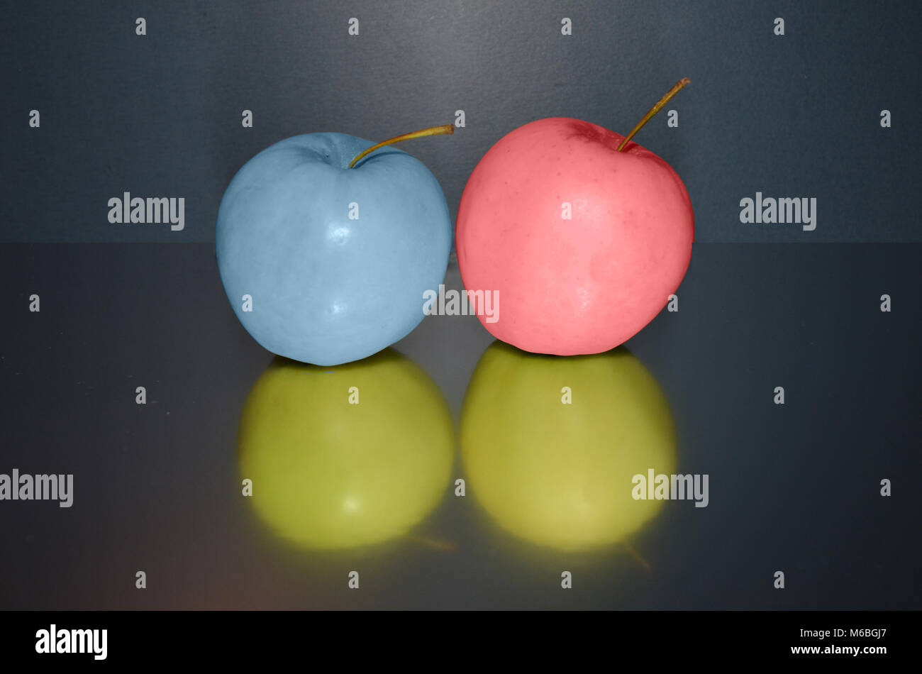 color swap apples, baby blue and pink Stock Photo - Alamy