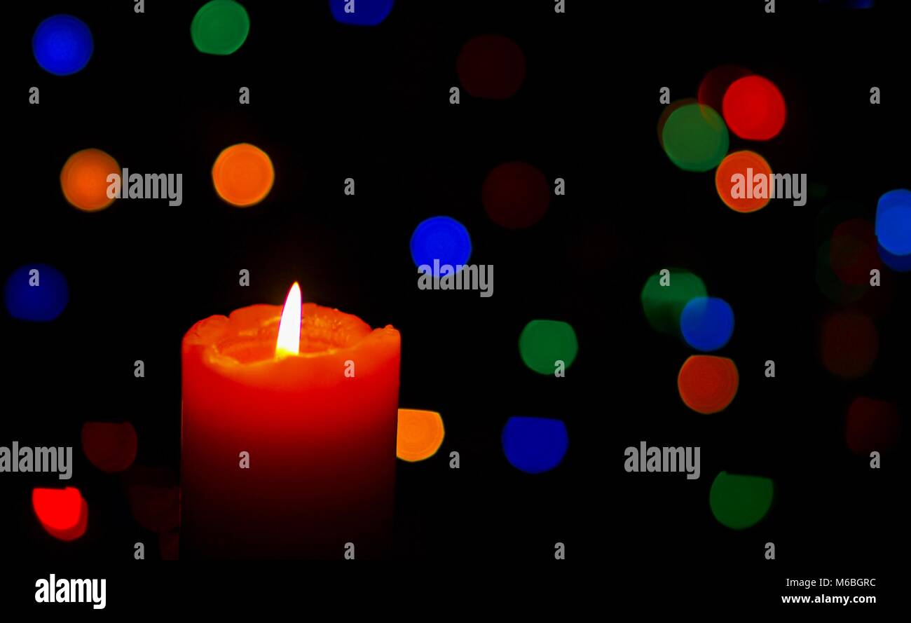 Red candle and the nice color fires Stock Photo - Alamy