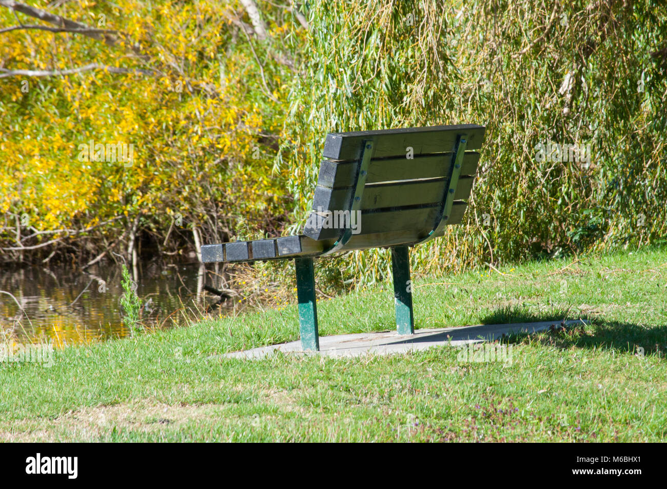 Outdoor Seat At The Edge Of A Pond Stock Photo - Alamy
