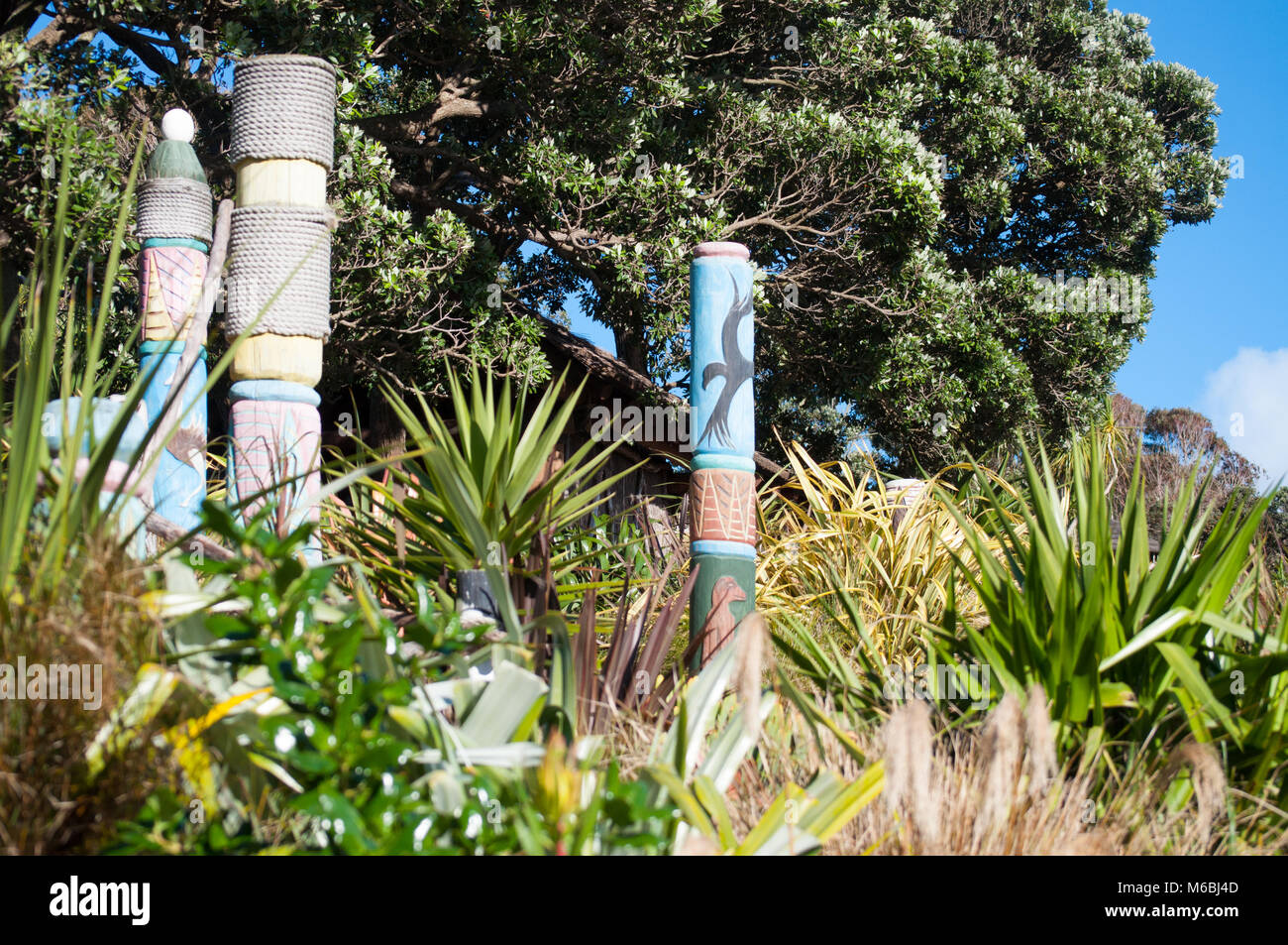 Decorated Wooden Posts In A Garden Stock Photo - Alamy