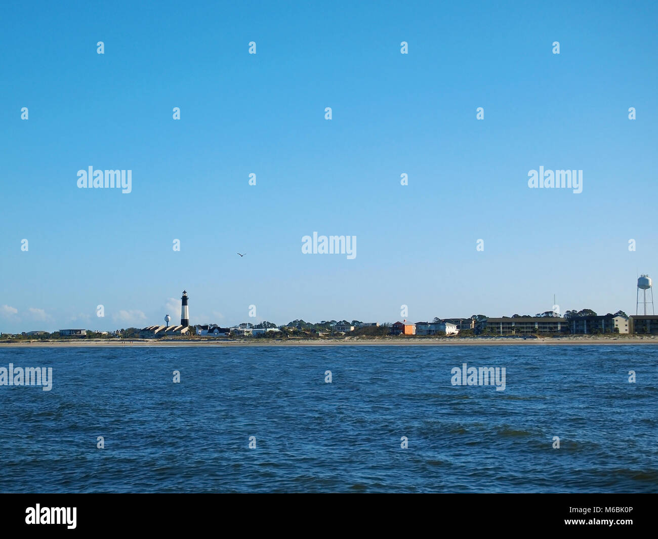 A view of the Tybee Island Lighthouse and sandy coastline from out in ...