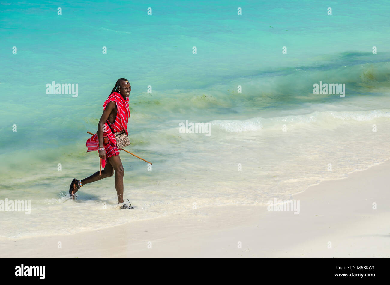Zanzibar, Tanzania - November 30, 2014: Young massai man with colorful ...