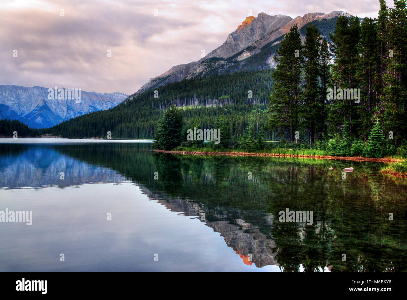 Sunset at Two Jack Lake in Banff National Park with sunlit mountain ...