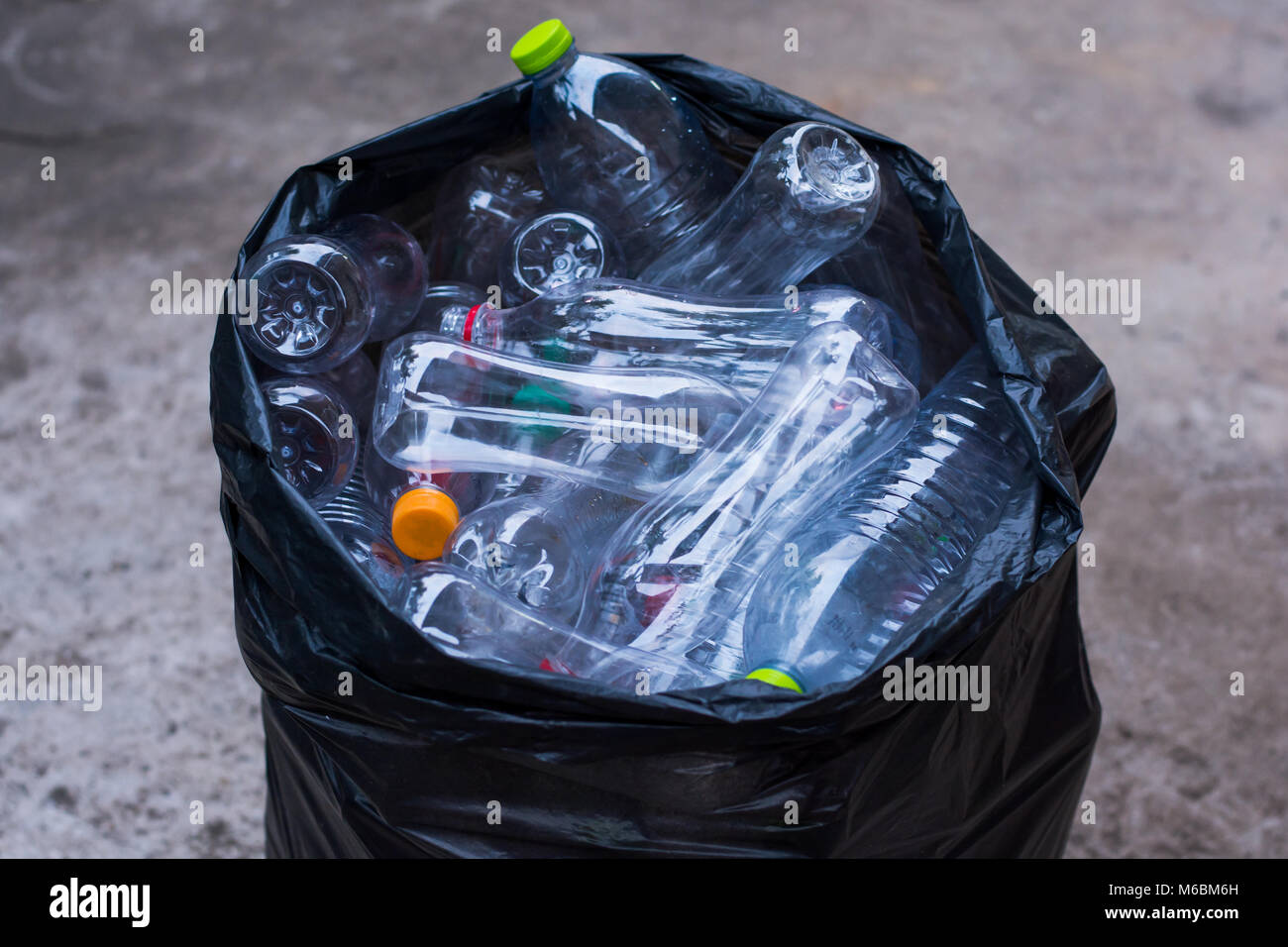 pile recyclable plastic bottles in trash bag Stock Photo - Alamy