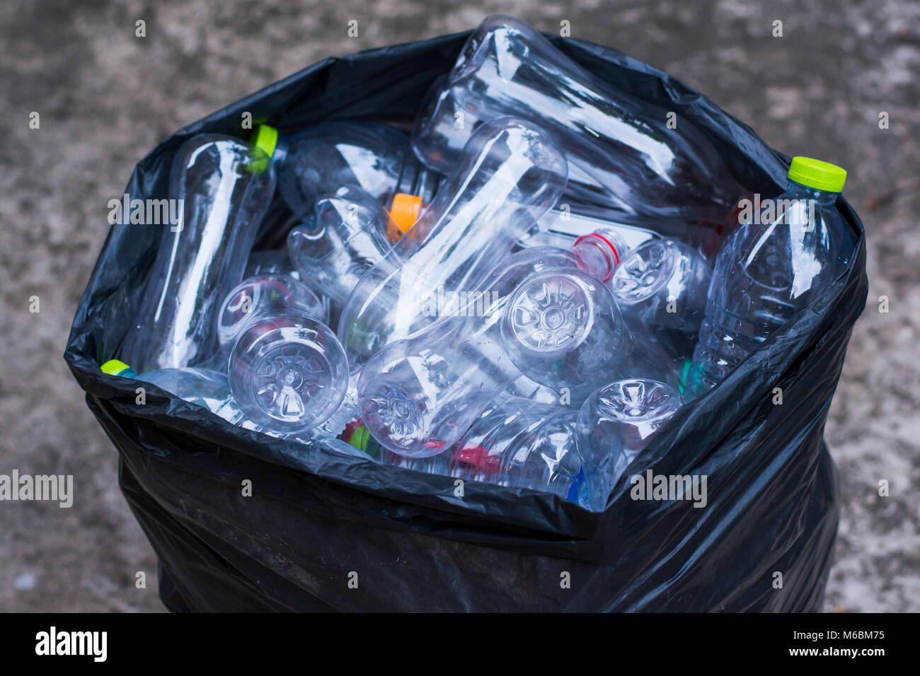 pile recyclable plastic bottles in trash bag Stock Photo - Alamy