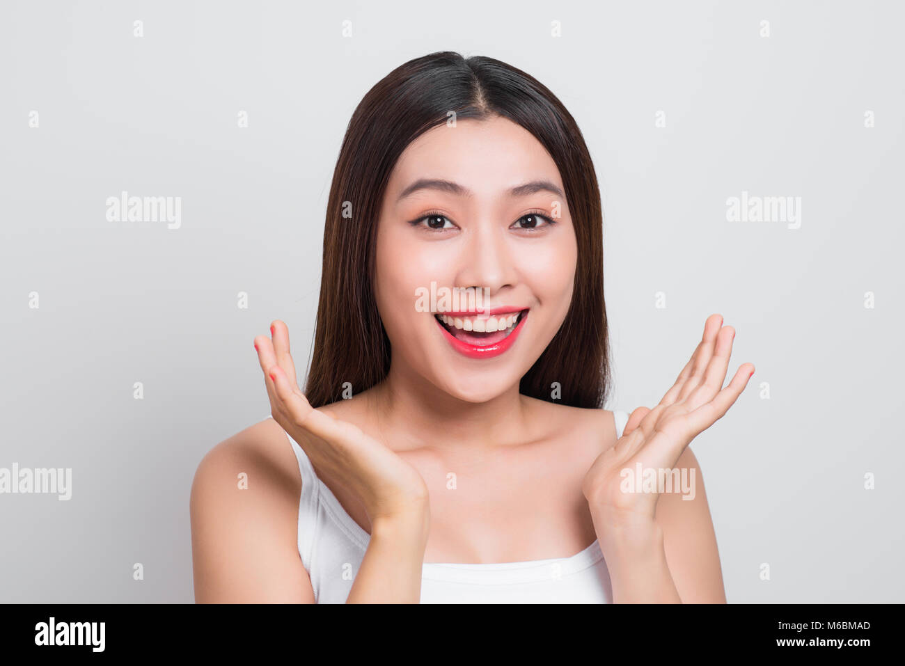 Asian girl hand touch cheek and smile attractive. Skin healthcare ...