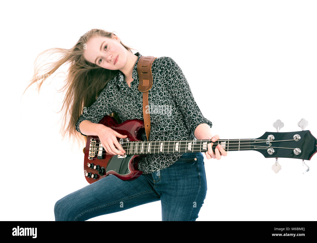 Girl playing bass guitar hi-res stock photography and images - Alamy