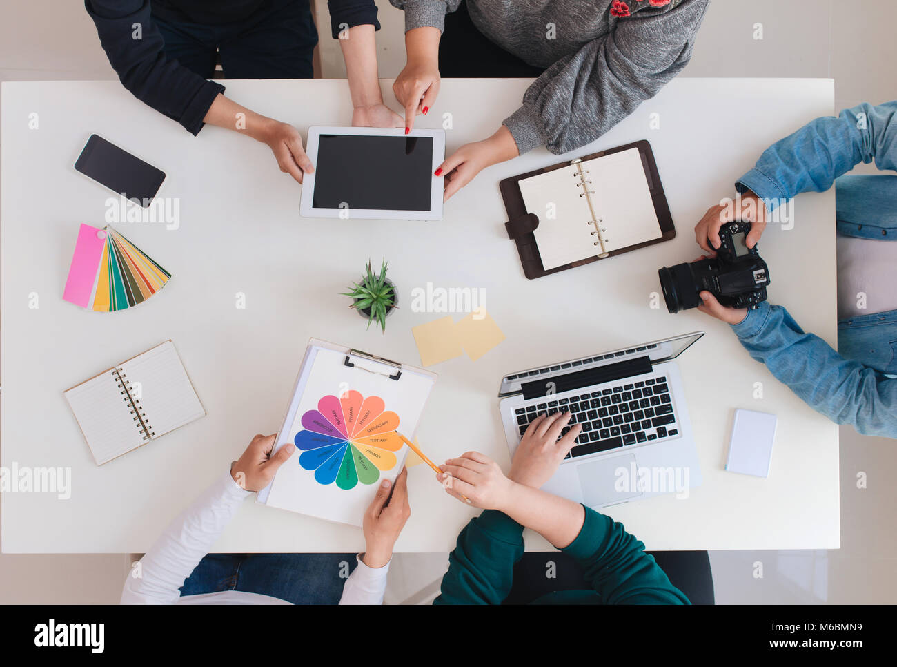 Young creative team having a meeting in creative office - teamwork ...