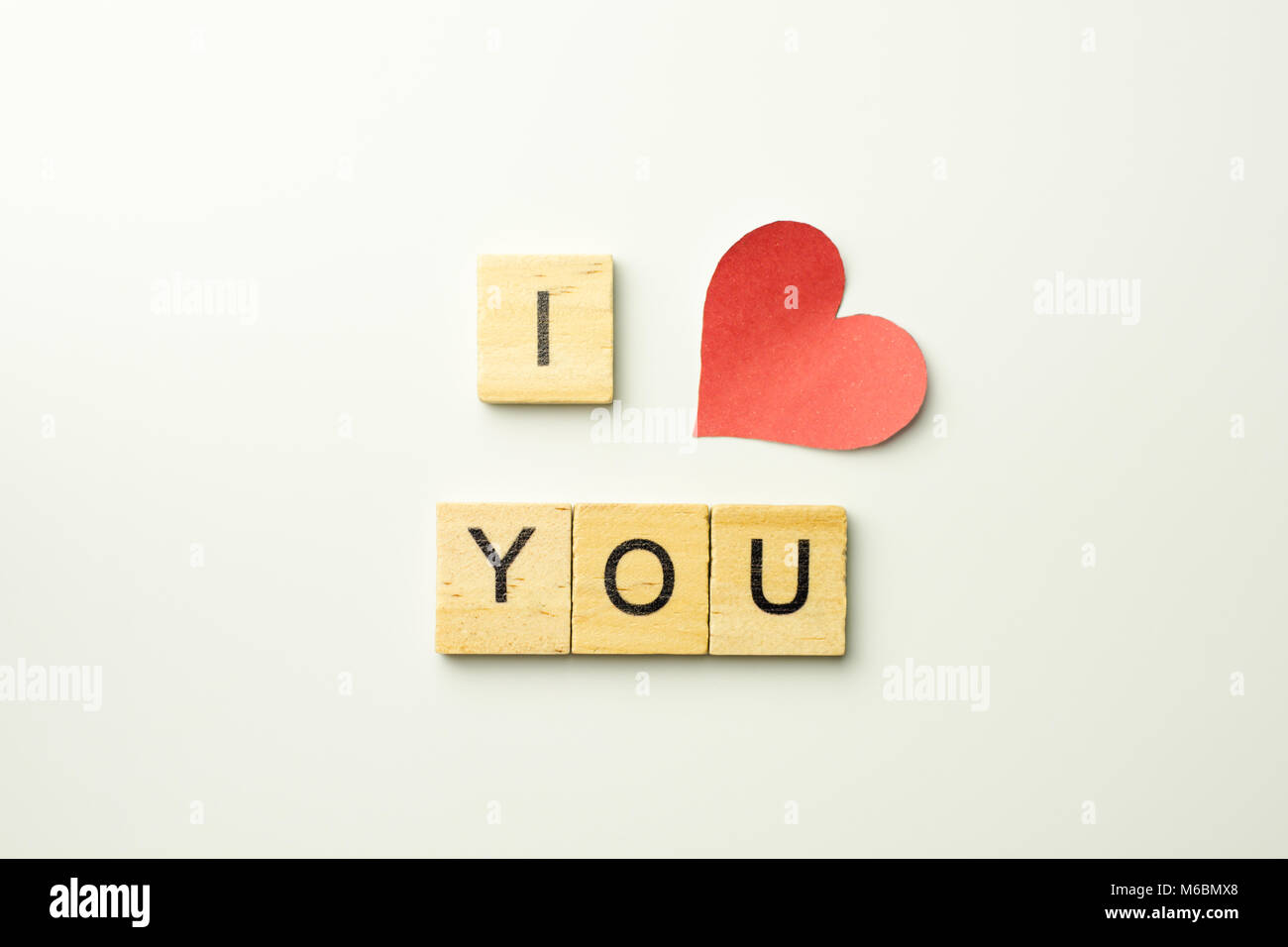 Text wooden blocks spelling the word I LOVE YOU on white background ...