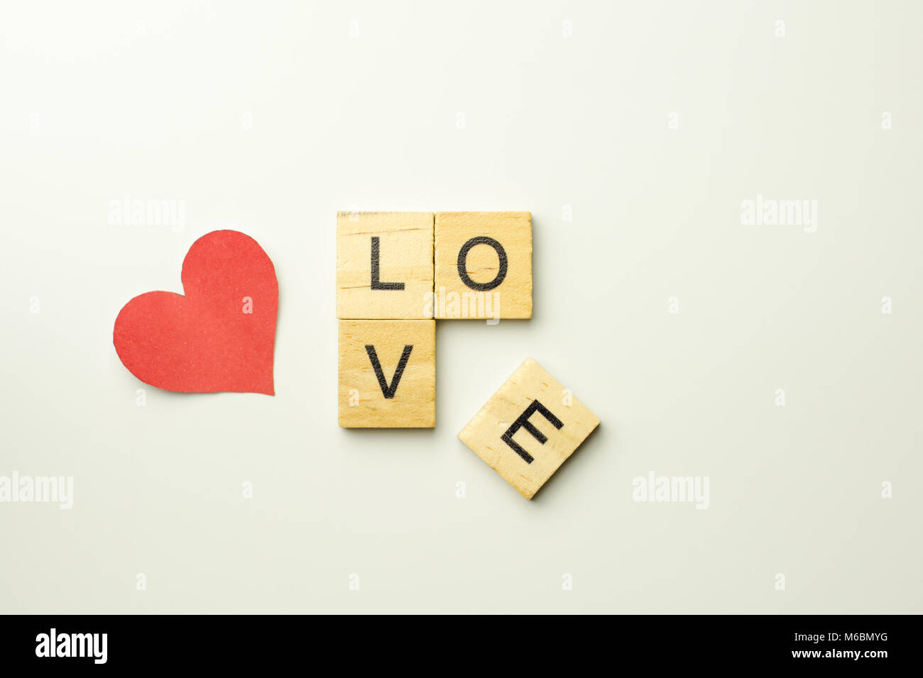 Text wooden blocks spelling the word LOVE on white background Stock ...