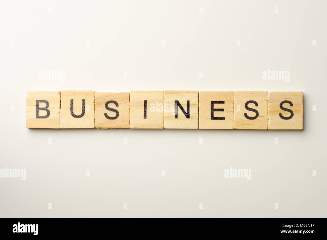 Text wooden blocks spelling the word BUSINESS on white background Stock ...