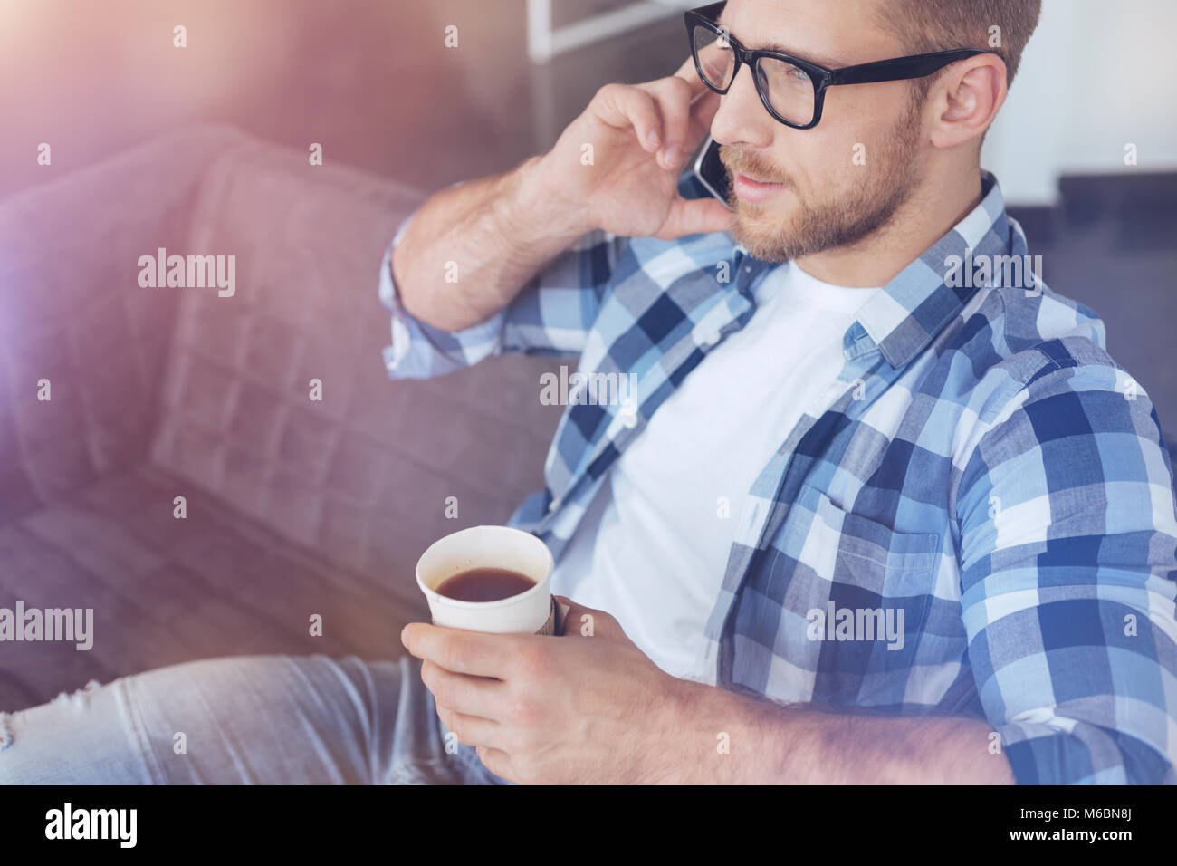 Handsome man chilling while having break Stock Photo - Alamy