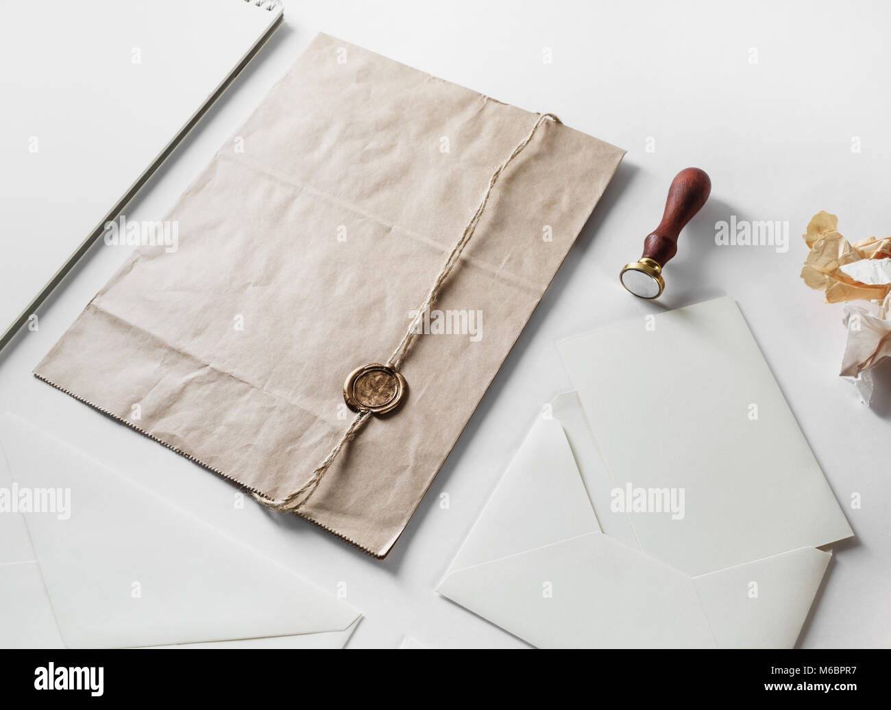 Vintage postal stationery with craft paper bag, wax seal, stamp and ...