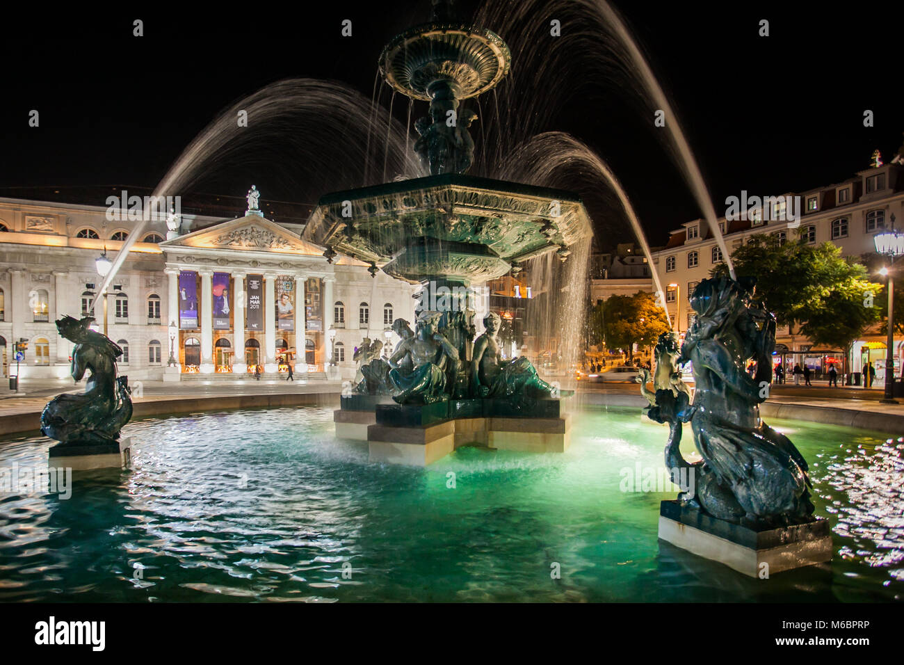 LISBON, PORTUGAL - January 26, 2011: Illuminated fountain at Rossio ...