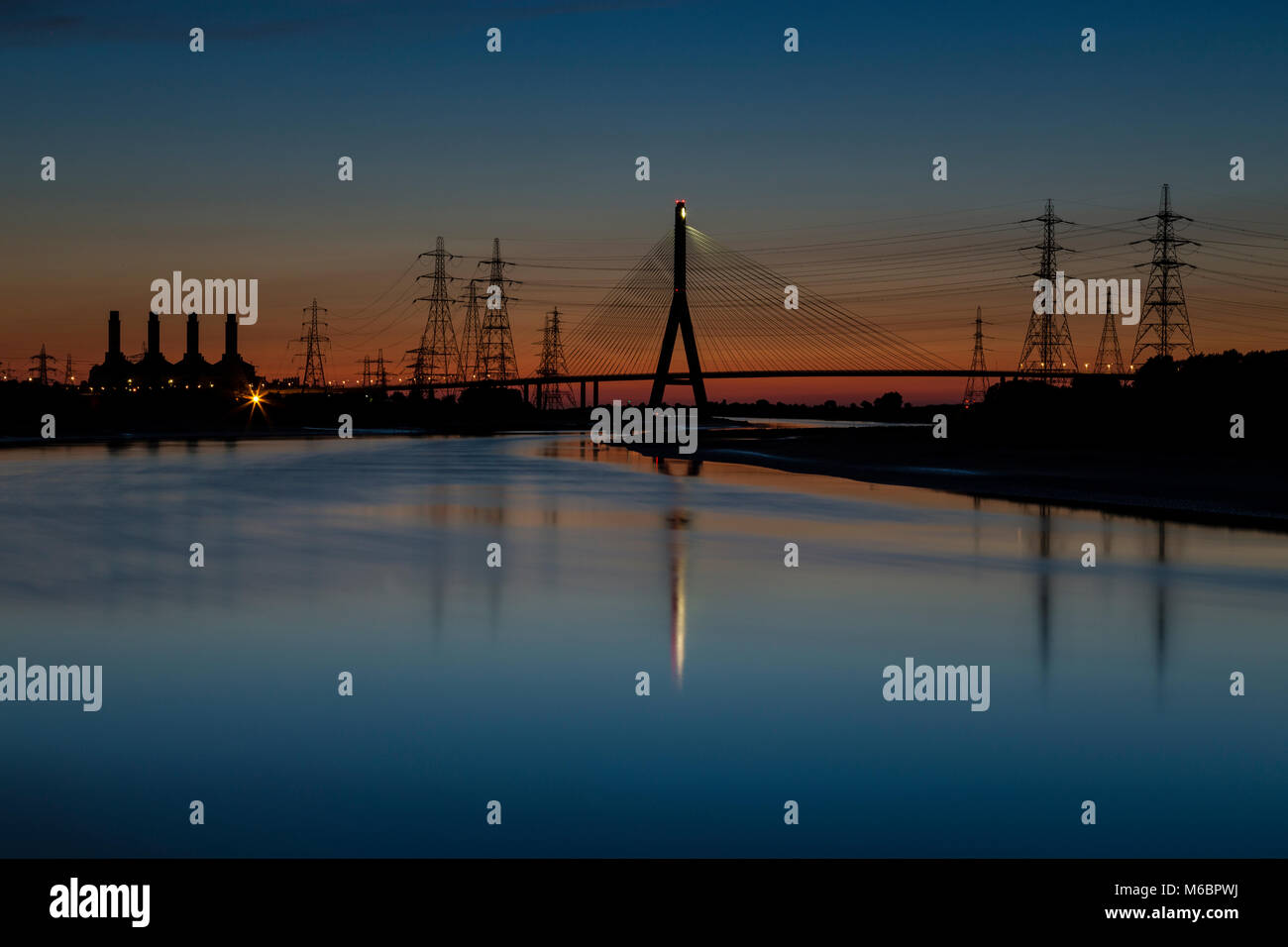 Suspension bridge over the river Dee and power station at Connah's Quay ...