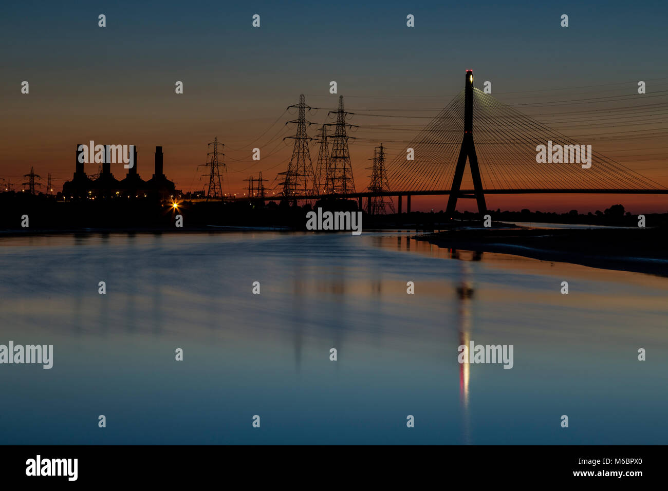 Suspension bridge over the river Dee and power station at Connah's Quay ...